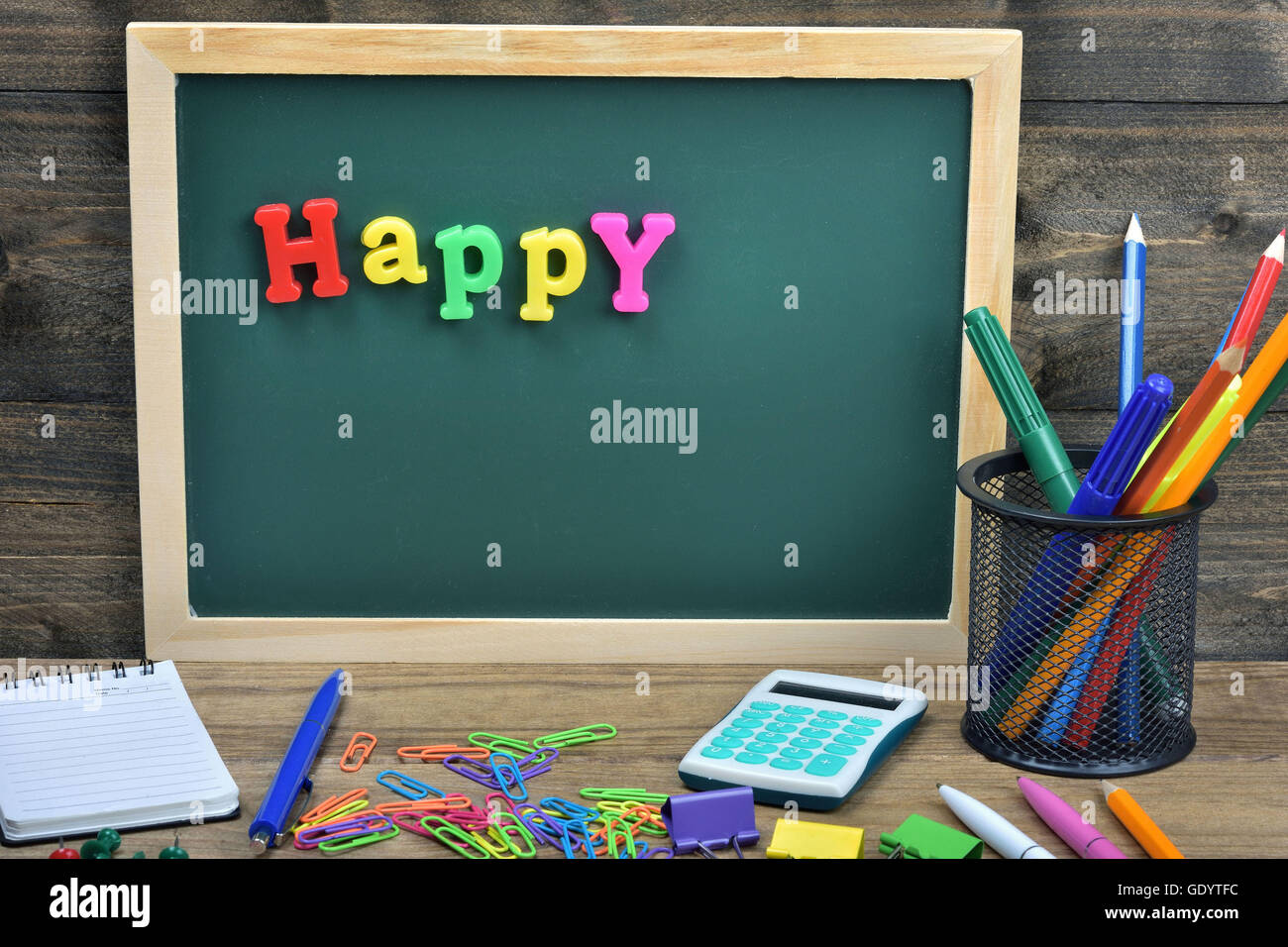 Happy word on school board Stock Photo - Alamy