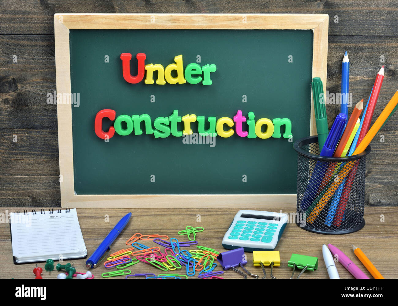 Under construction word on school board Stock Photo - Alamy