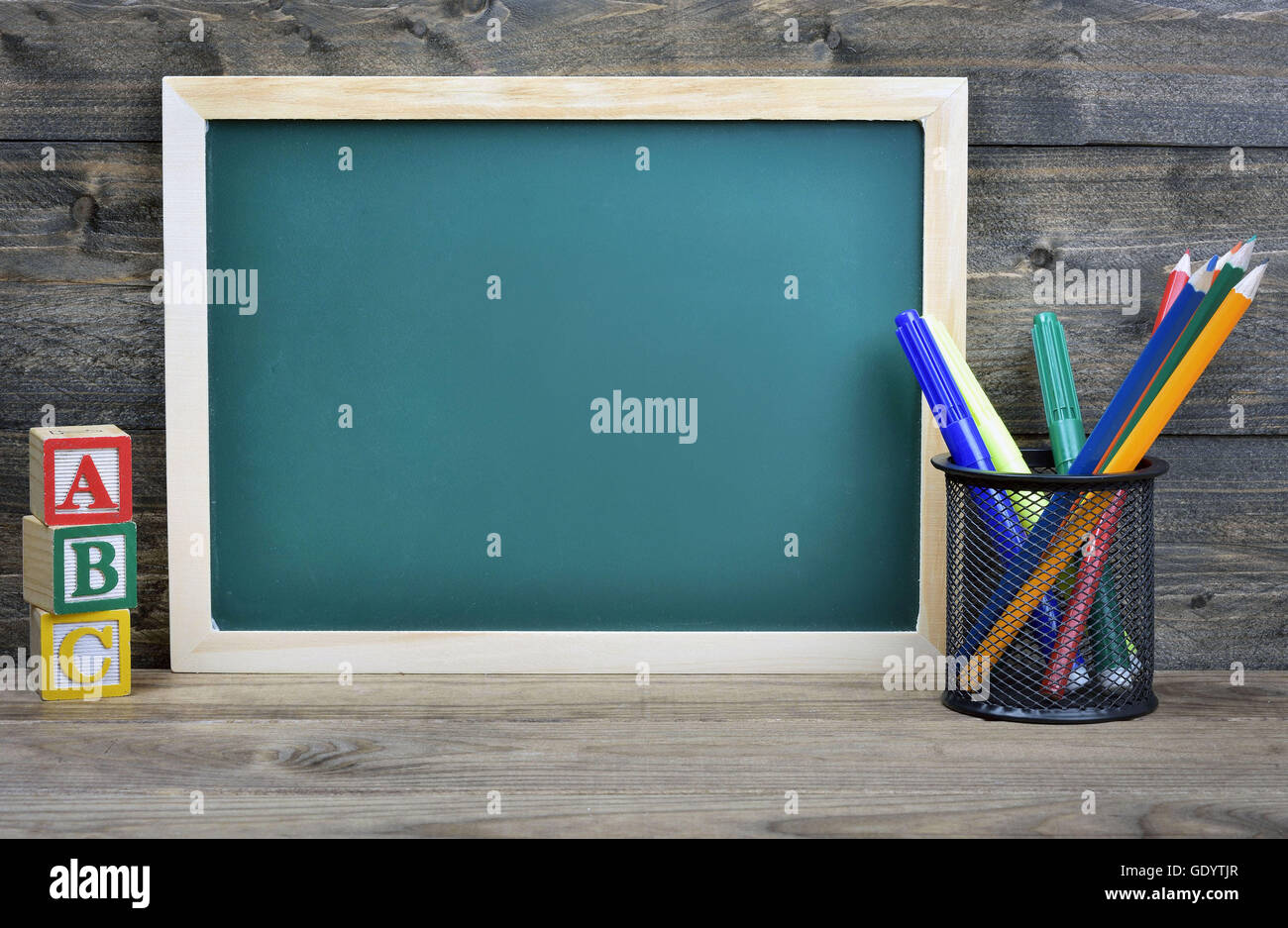 School board and abc letters on wooden table Stock Photo - Alamy