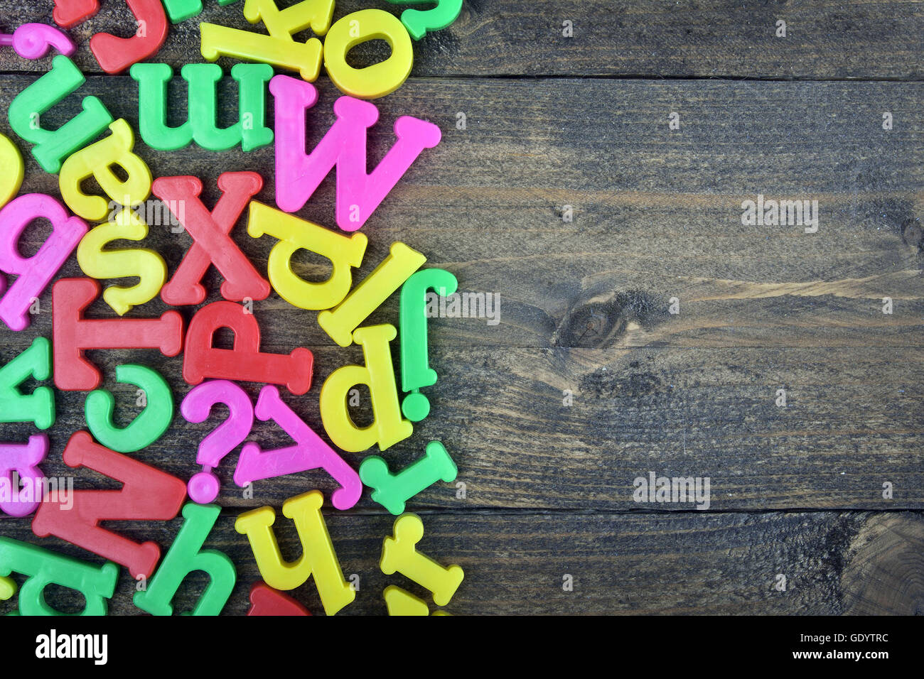 Many letters on wooden table Stock Photo - Alamy
