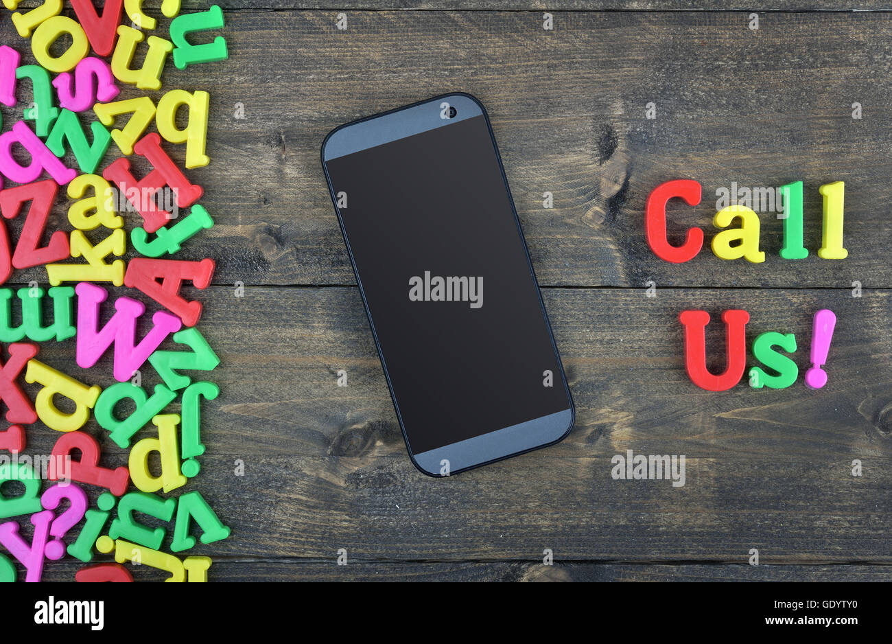 Call Us word on wooden table Stock Photo - Alamy