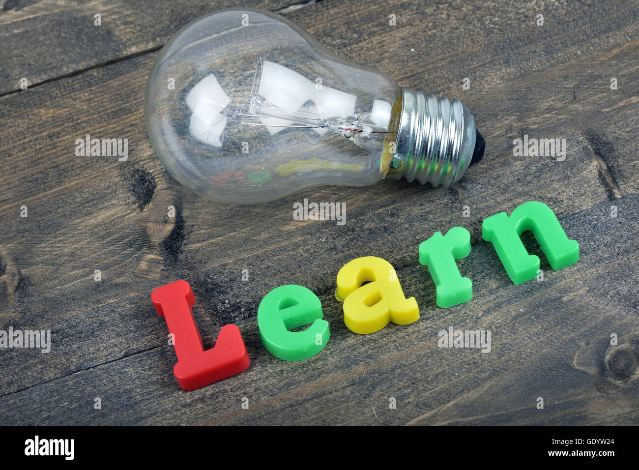 Learn word on wooden table Stock Photo - Alamy