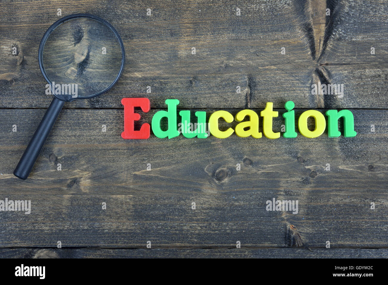 Education word on wooden table Stock Photo - Alamy