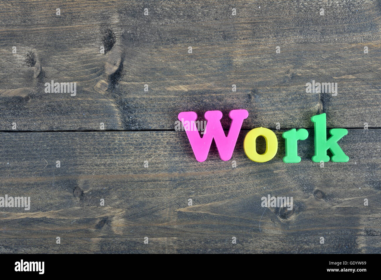 Work word on wooden table Stock Photo - Alamy