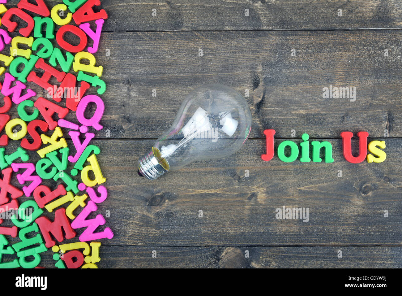 Join Us word on wooden table Stock Photo - Alamy