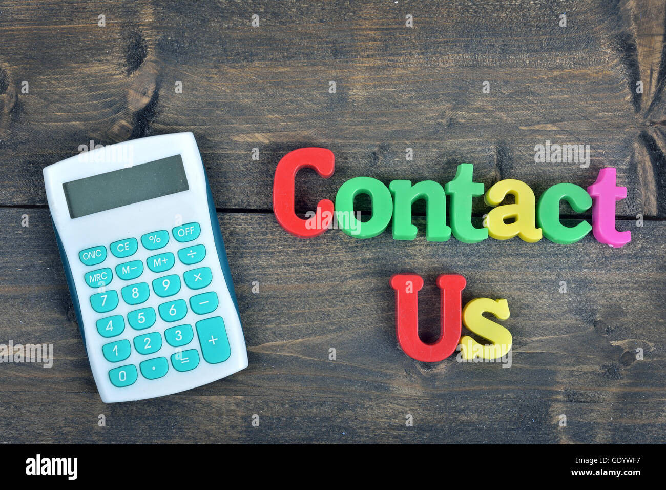 Contact us word on wooden table Stock Photo - Alamy