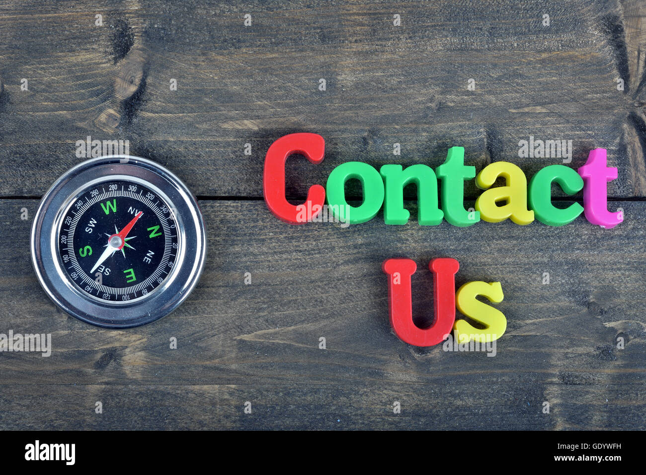 Contact us word on wooden table Stock Photo - Alamy