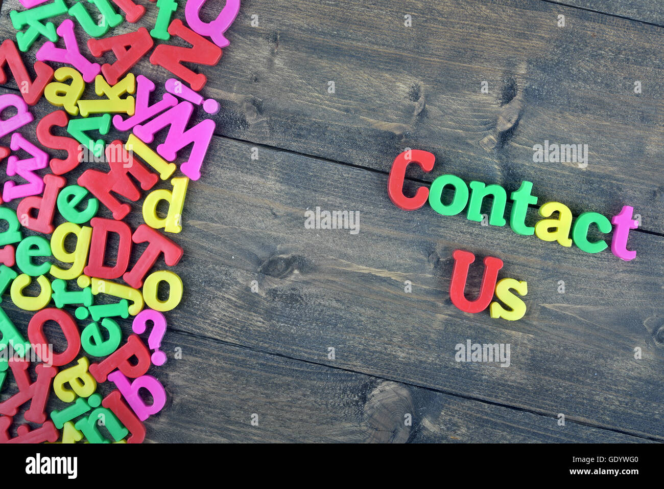 Contact us word on wooden table Stock Photo - Alamy