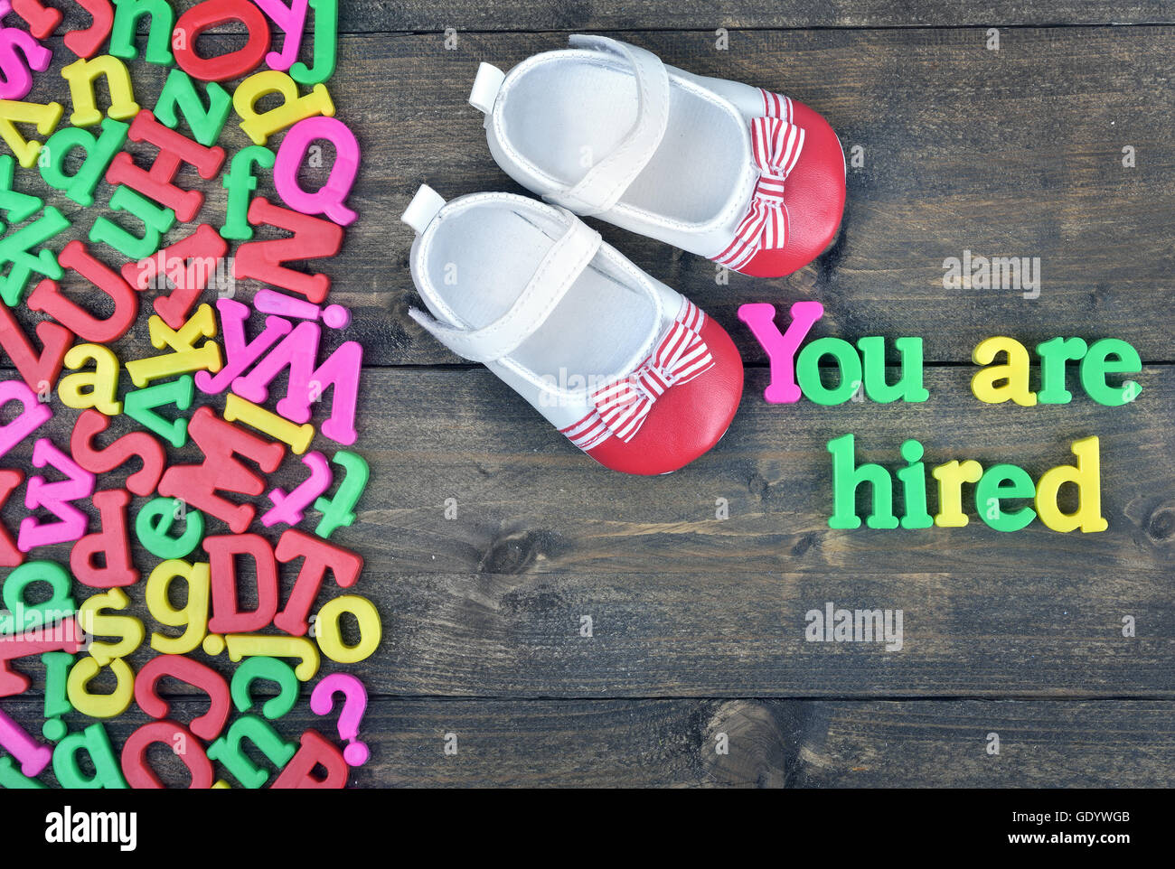 You are hired word on wooden table Stock Photo - Alamy