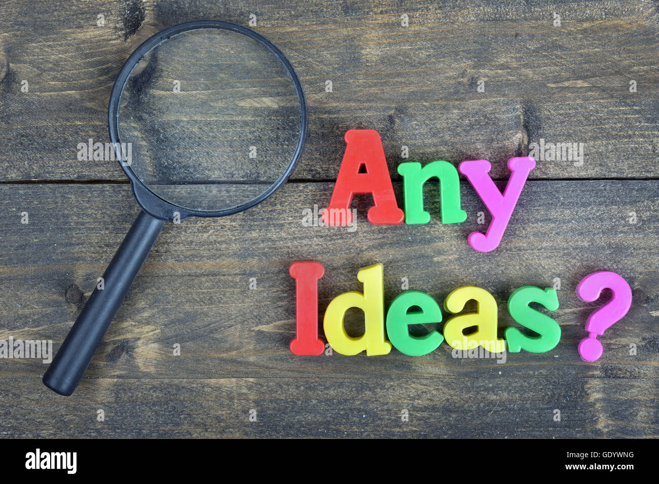 Any ideas ? question on wooden table Stock Photo - Alamy