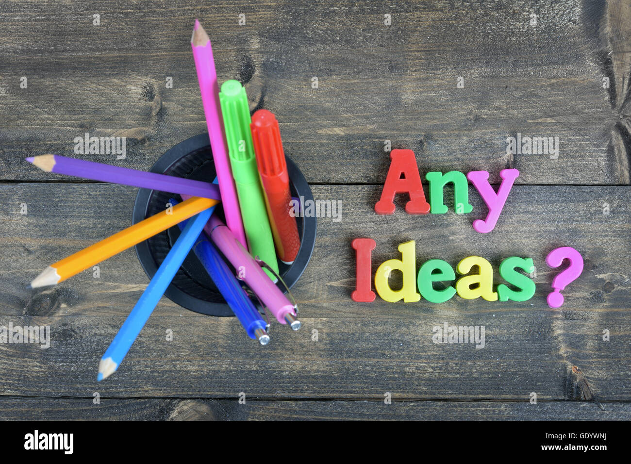 Any ideas ? question on wooden table Stock Photo - Alamy