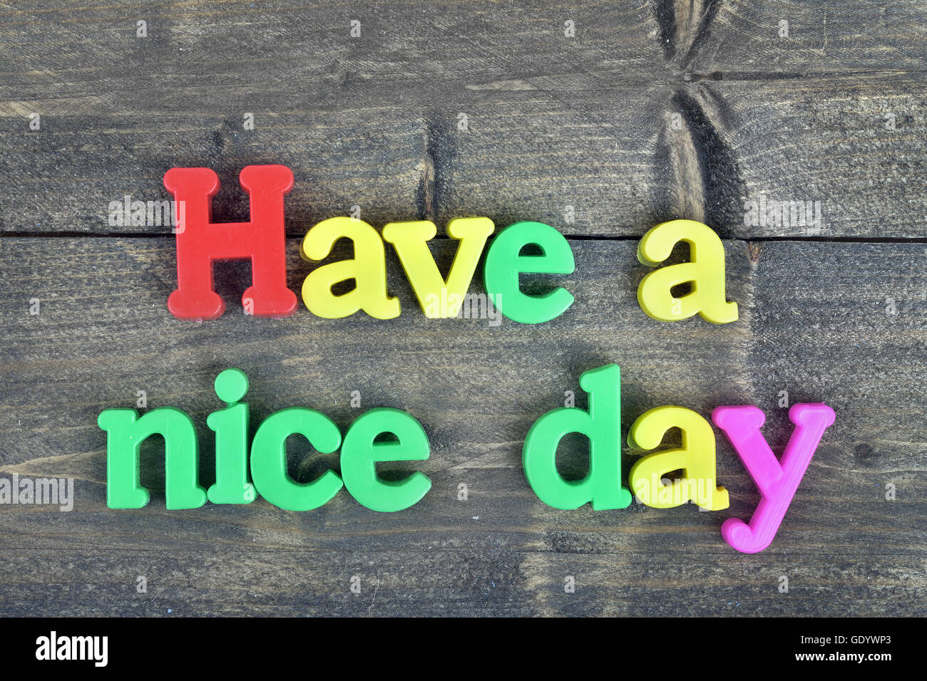 Have a nice day text on wooden table Stock Photo - Alamy