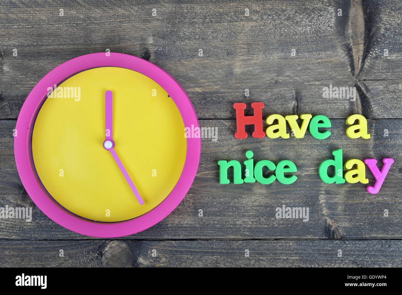 Have a nice day text on wooden table Stock Photo - Alamy