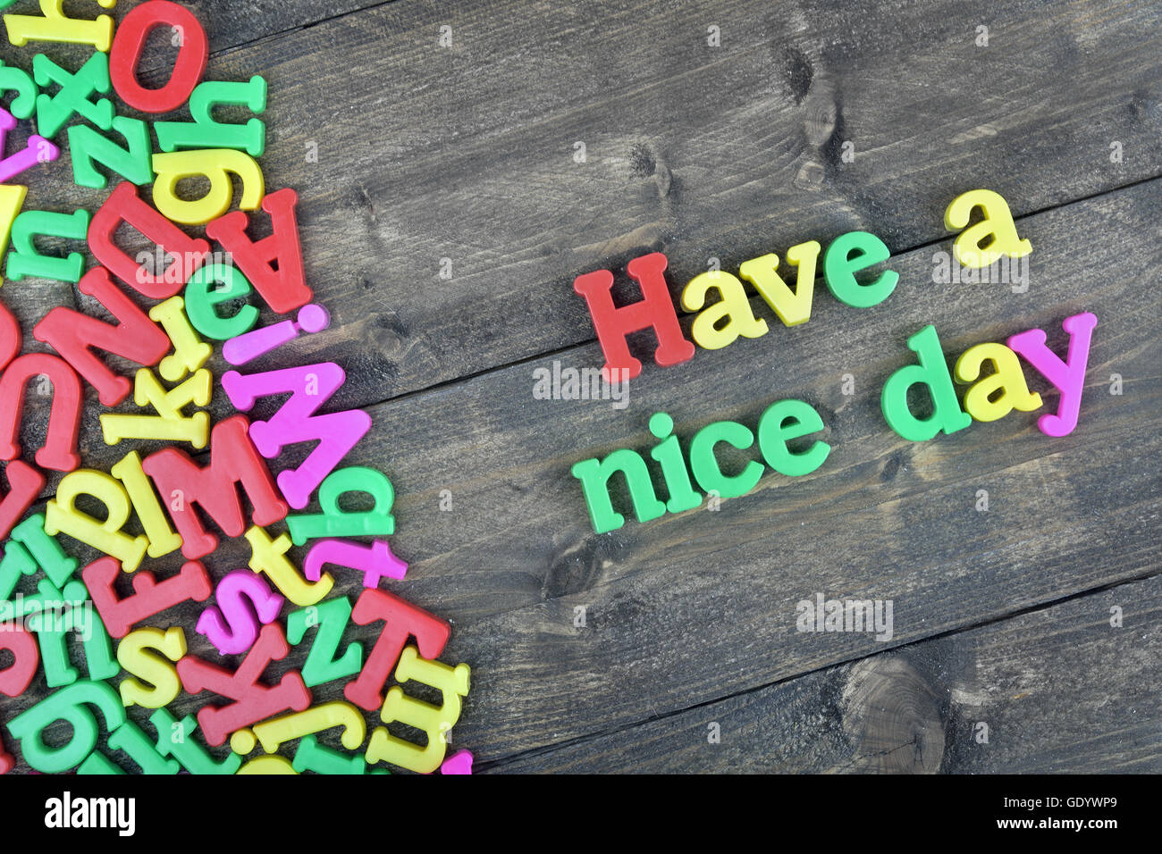 Have a nice day text on wooden table Stock Photo - Alamy