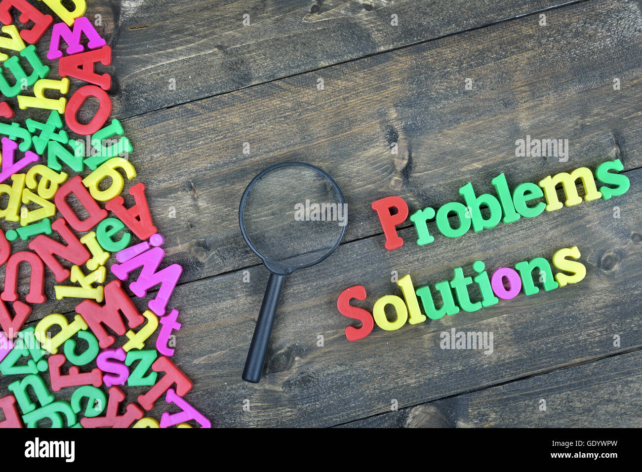 Problems and Solutions word on wooden table Stock Photo - Alamy
