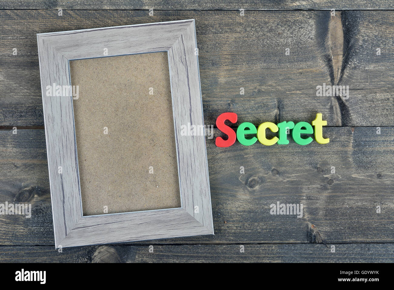 Secret word on wooden table Stock Photo - Alamy