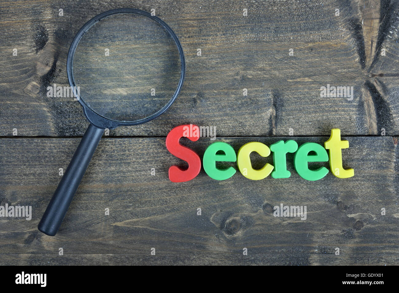 Secret word on wooden table Stock Photo - Alamy