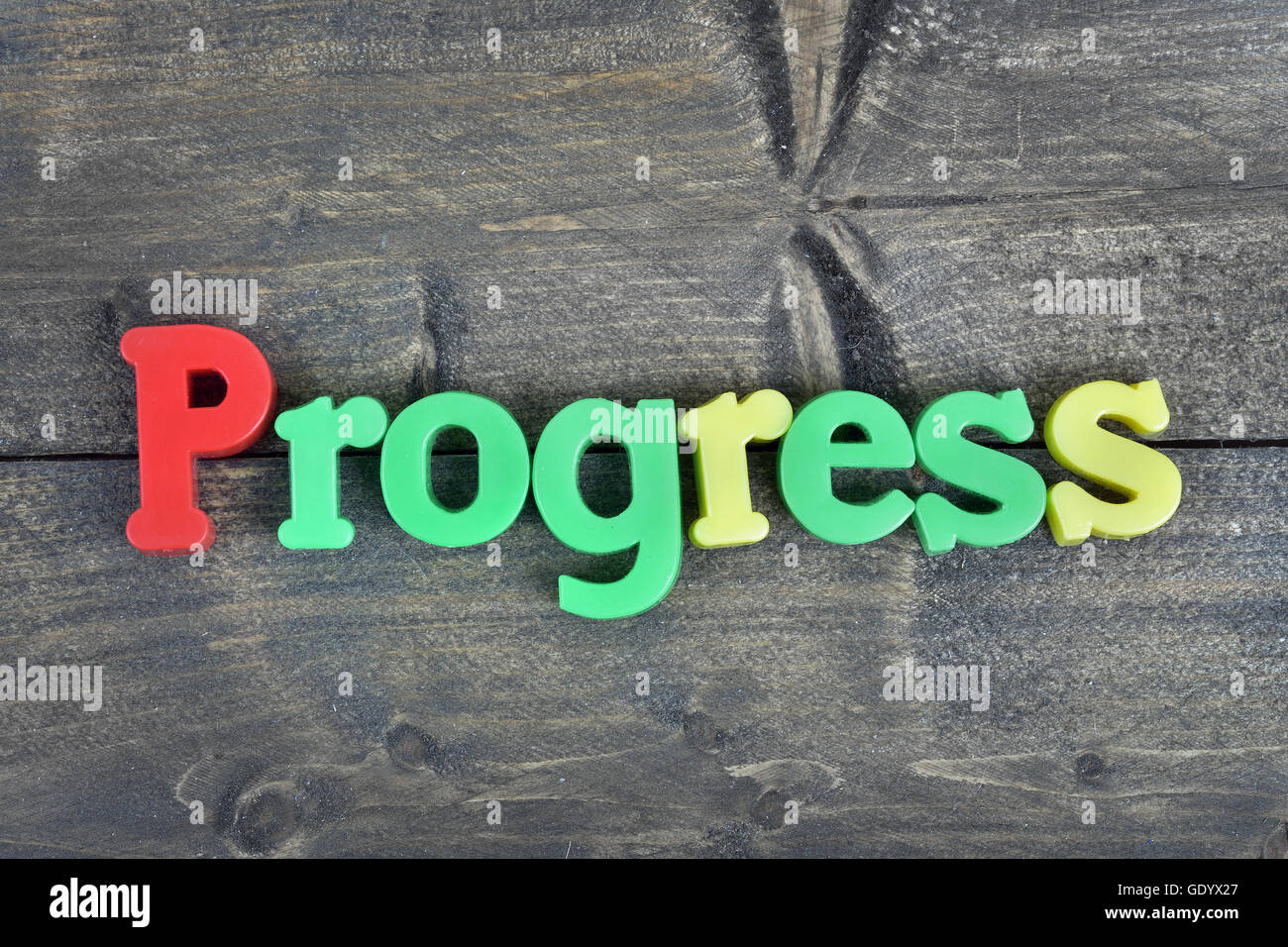Progress word on wooden table Stock Photo - Alamy