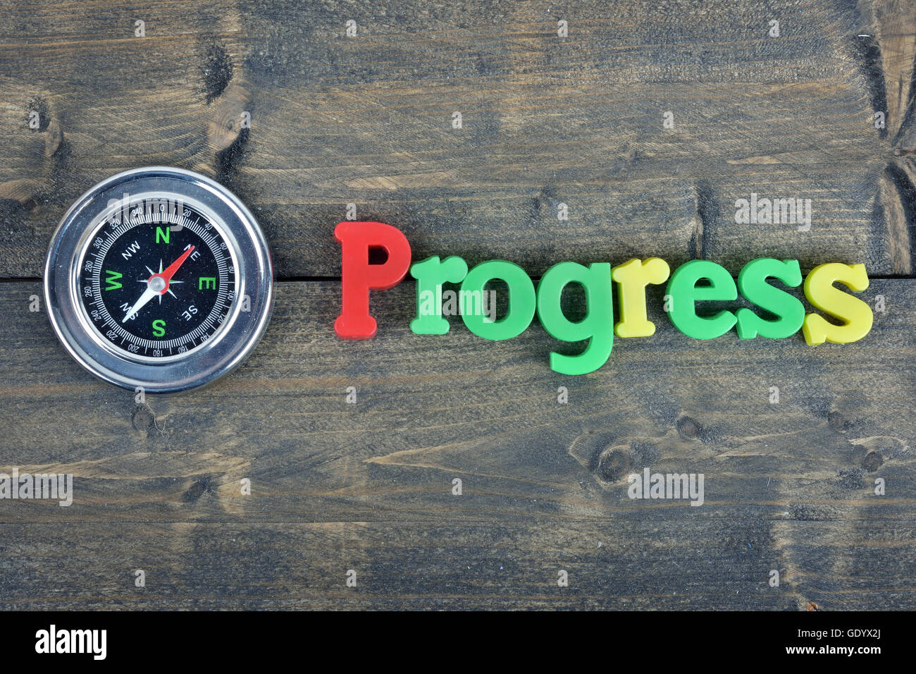 Progress word on wooden table Stock Photo - Alamy