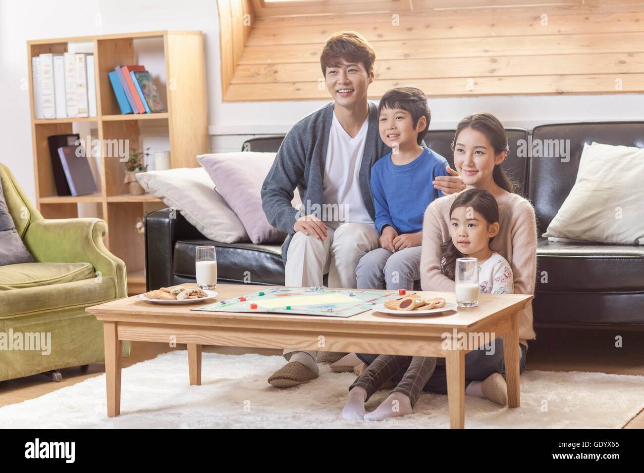 Harmonious family in a living room Stock Photo - Alamy
