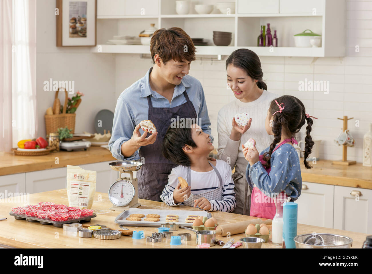 Harmonious family eating Christmas cookies Stock Photo - Alamy