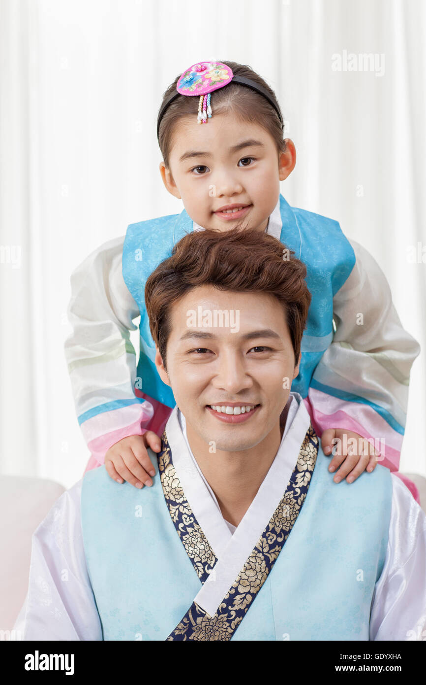 Portrait of smiling father and girl in traditional Korean clothes Stock ...