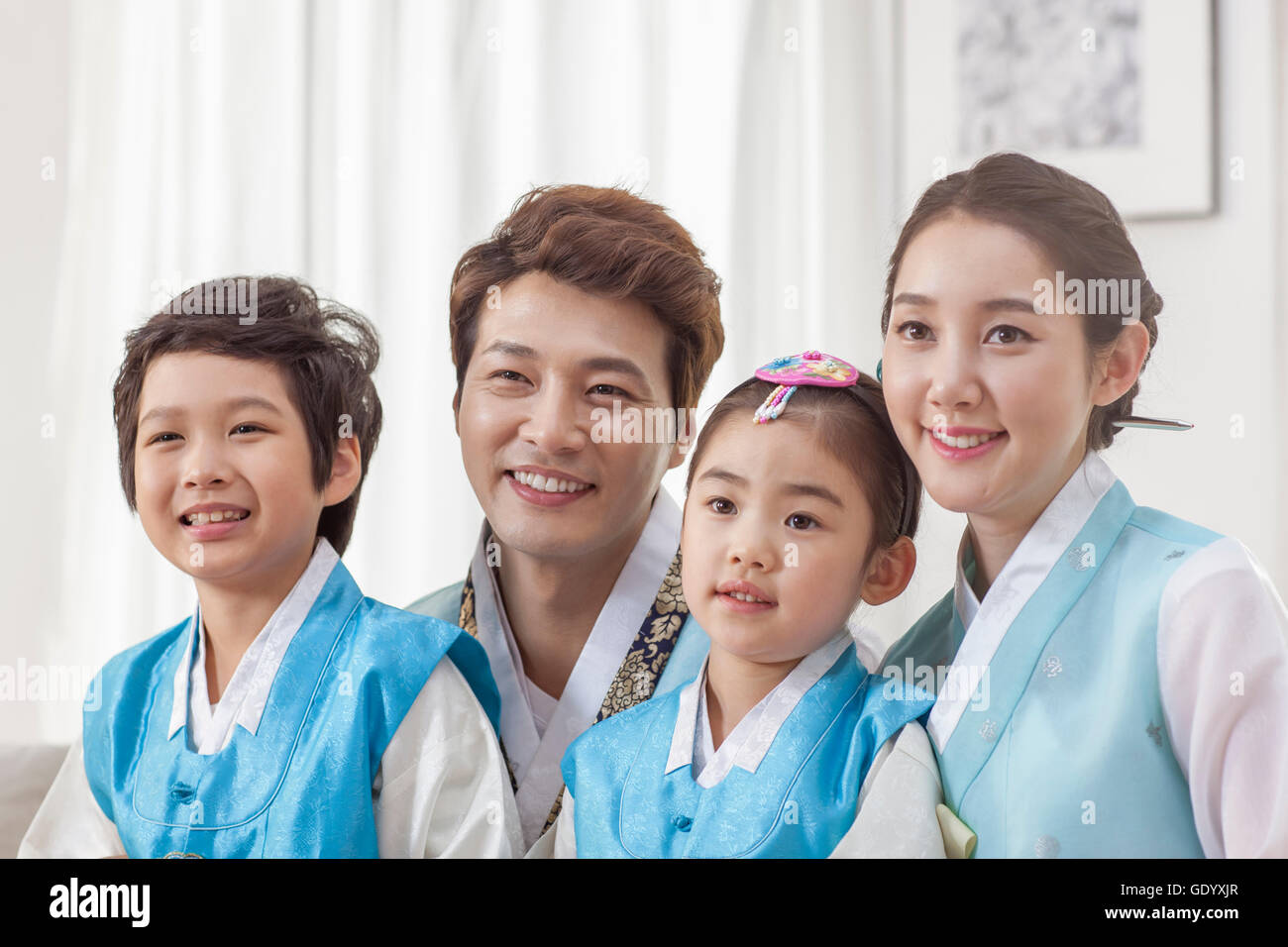 Portrait of smiling family in traditional Korean clothes Stock Photo ...