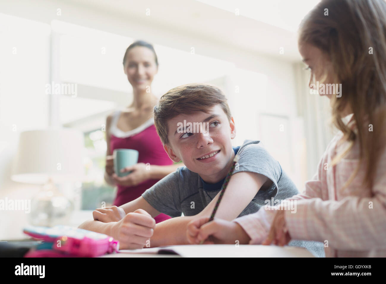 Caucasian mother doing homework son hi-res stock photography and images ...