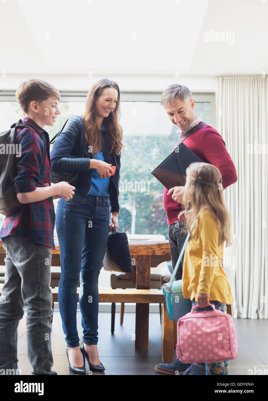 Family preparing to leave house in the morning Stock Photo - Alamy