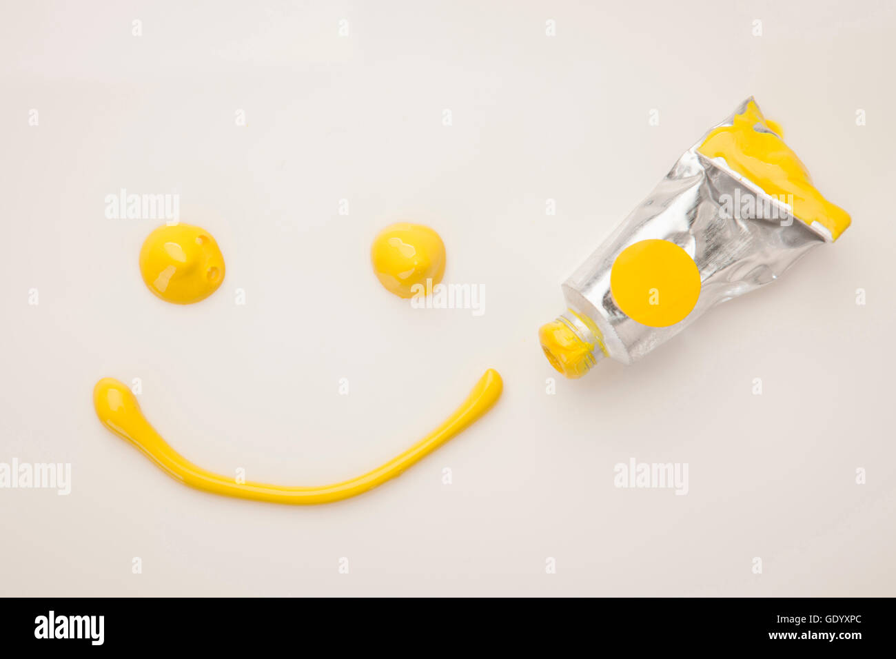 Smiling face made of yellow watercolor Stock Photo - Alamy