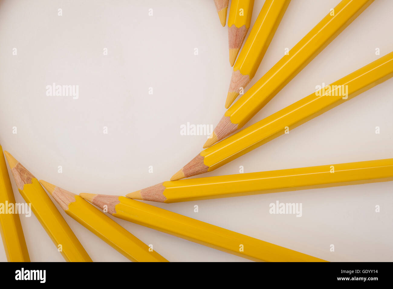 Part of a frame with yellow colored pencils Stock Photo - Alamy