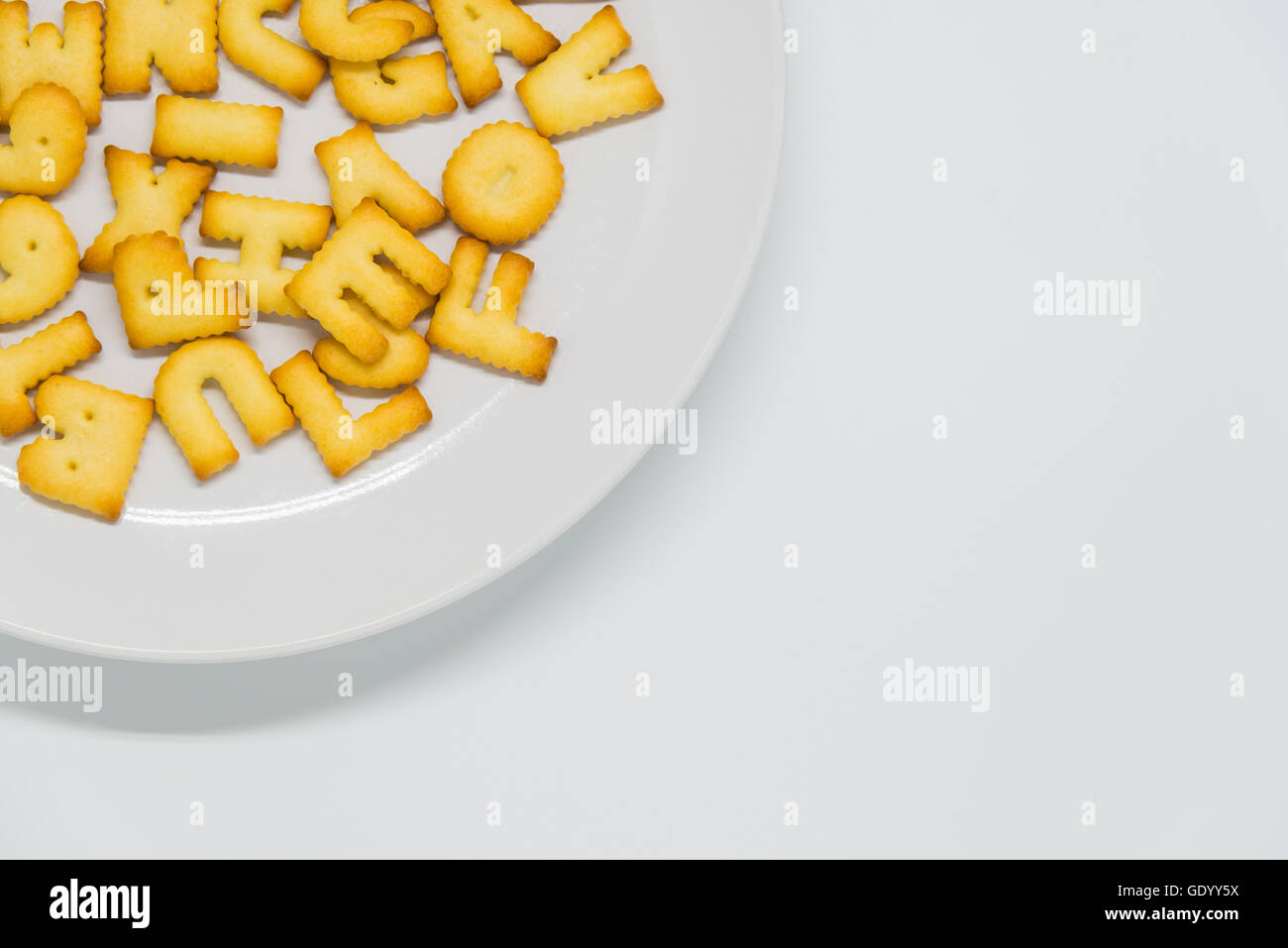 Alphabet cracker in dish with white background 3 Stock Photo - Alamy