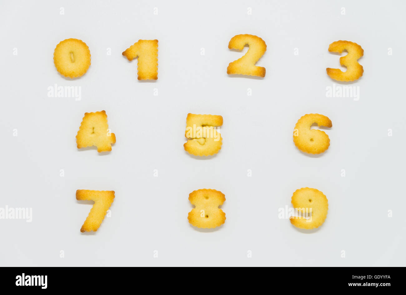 Cracker in shape of number with white background Stock Photo - Alamy