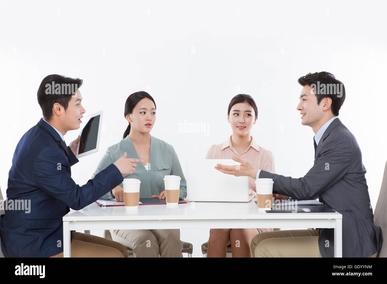 Business people sitting around table hi-res stock photography and ...