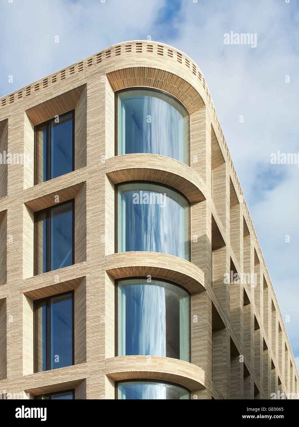Detail of brick facade with curved glazing. Turnmill Building, London ...