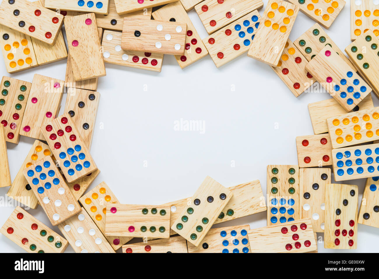 Wooden dominoes and space in the middle on white background with ...