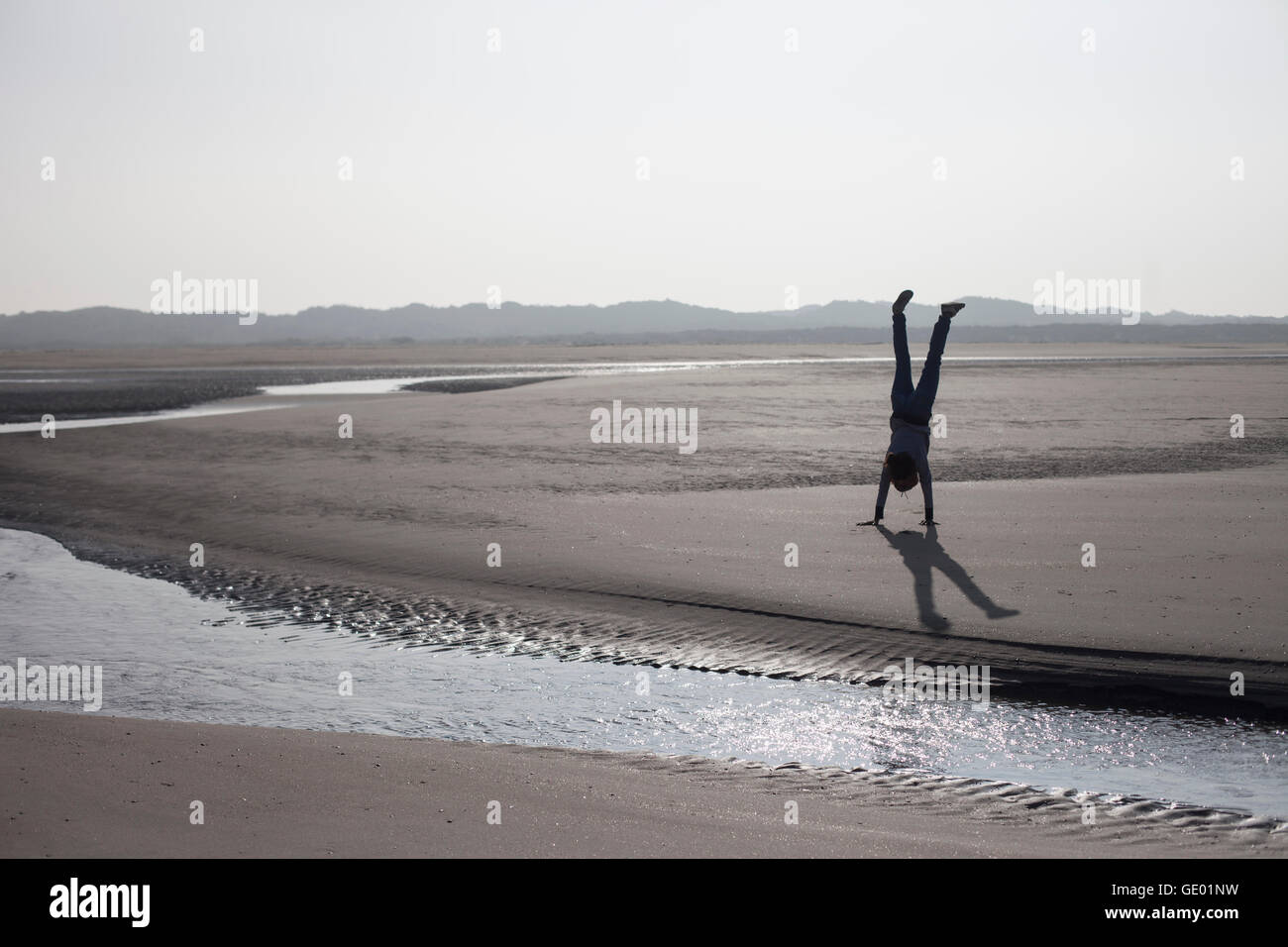 Handstand on beach hi-res stock photography and images - Alamy