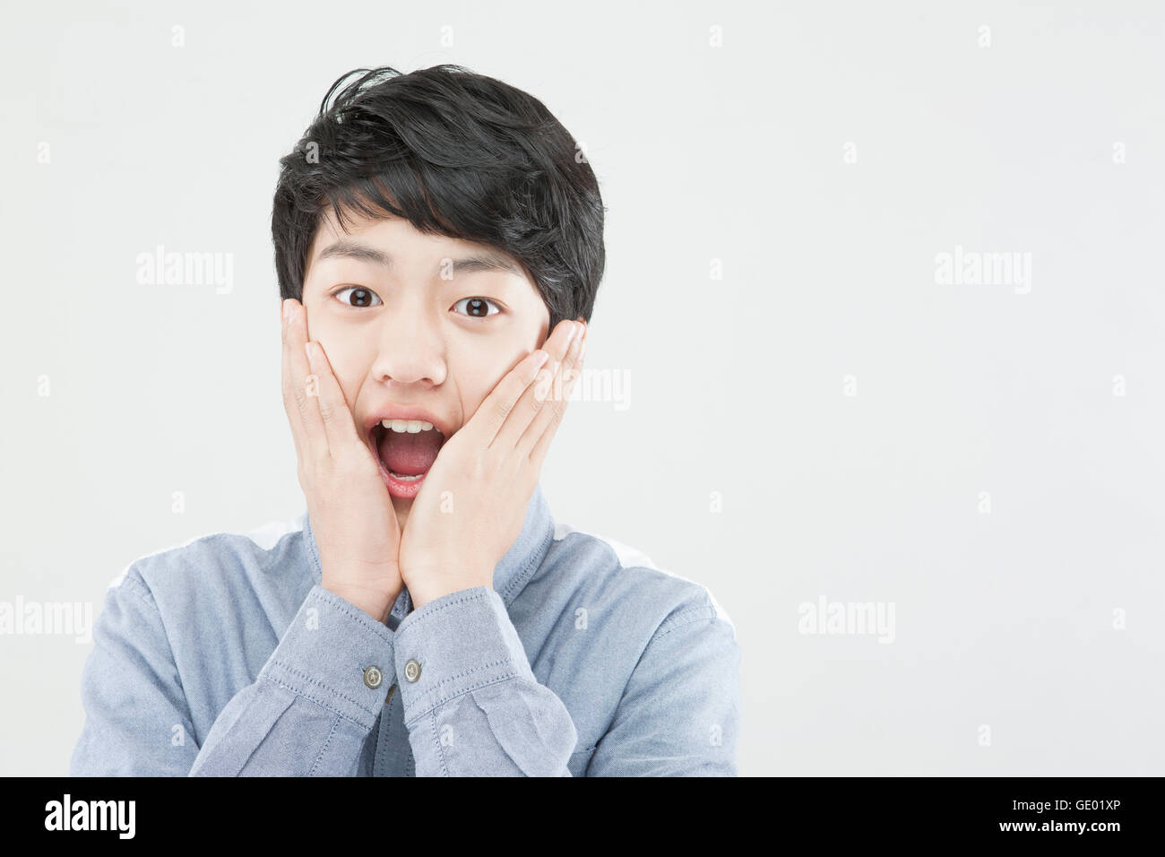 Portrait of school boy with surprised face Stock Photo - Alamy