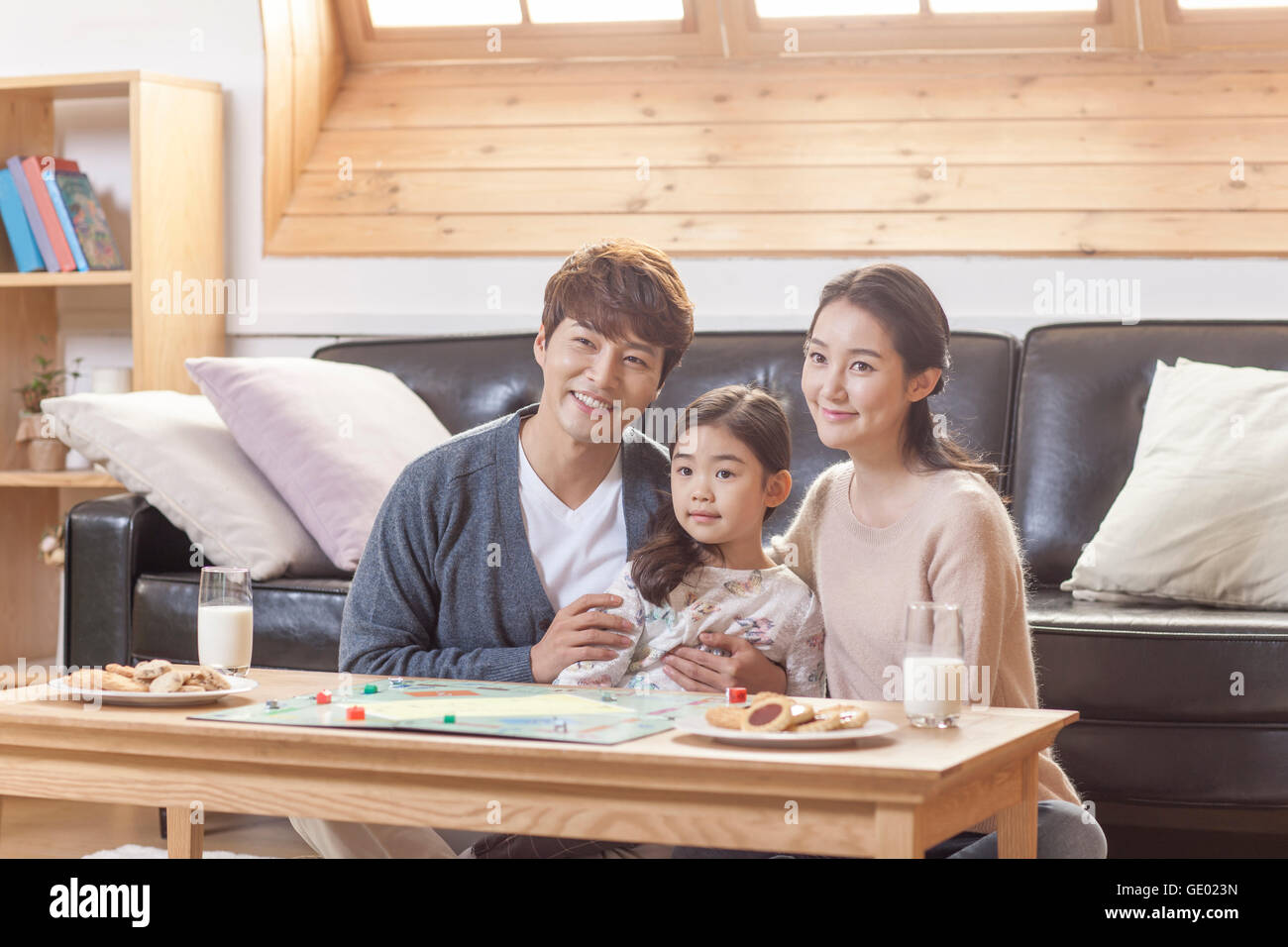 Harmonious family posing in living room Stock Photo - Alamy
