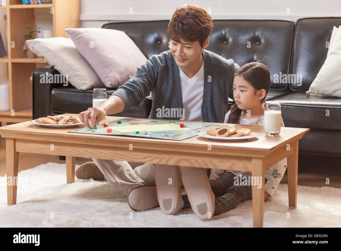 Loving father and daughter playing a game together Stock Photo - Alamy