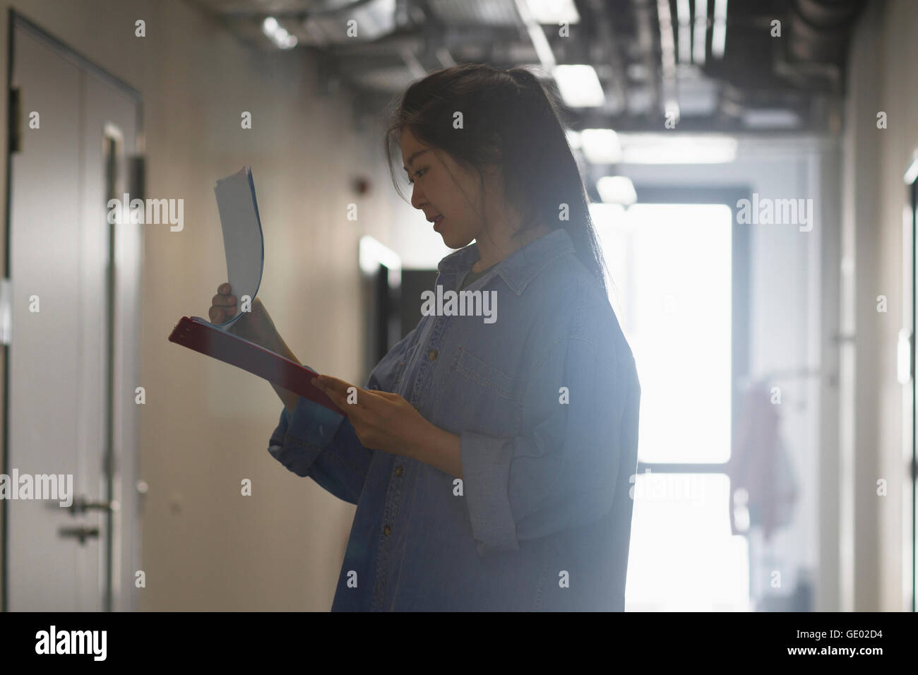 Young female engineer working in an industrial plant, Freiburg im ...