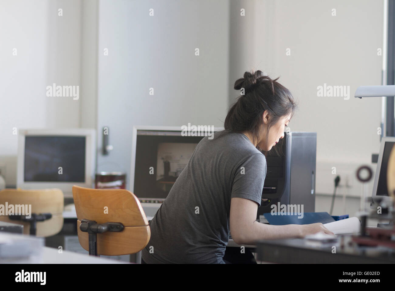 Young female engineer working on computer in an office, Freiburg im ...