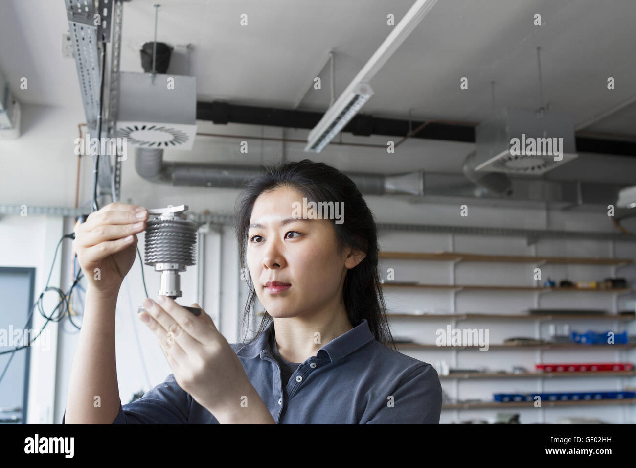 Young female engineer working in an industrial plant, Freiburg im ...