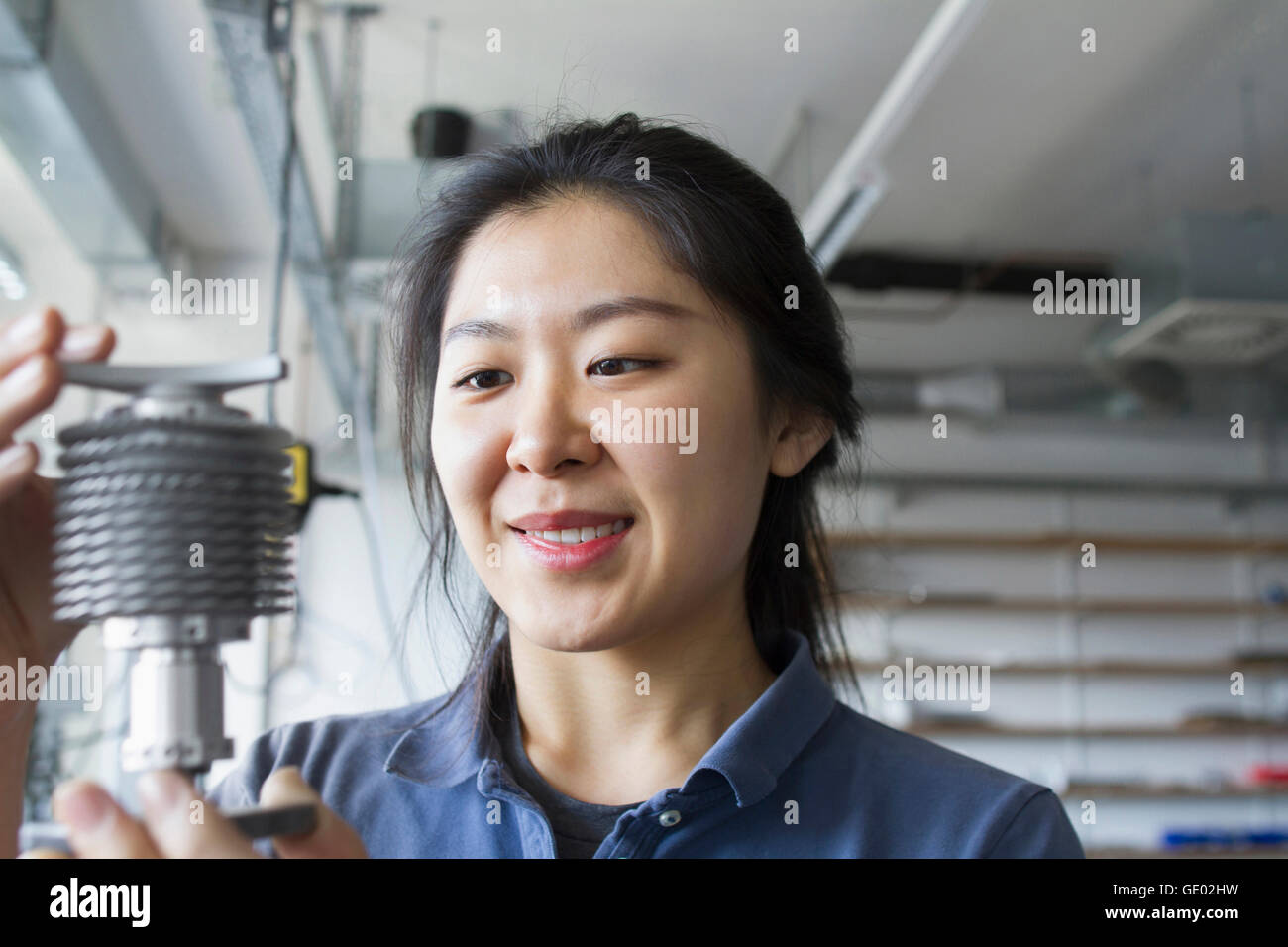 Young female engineer working in an industrial plant, Freiburg im ...