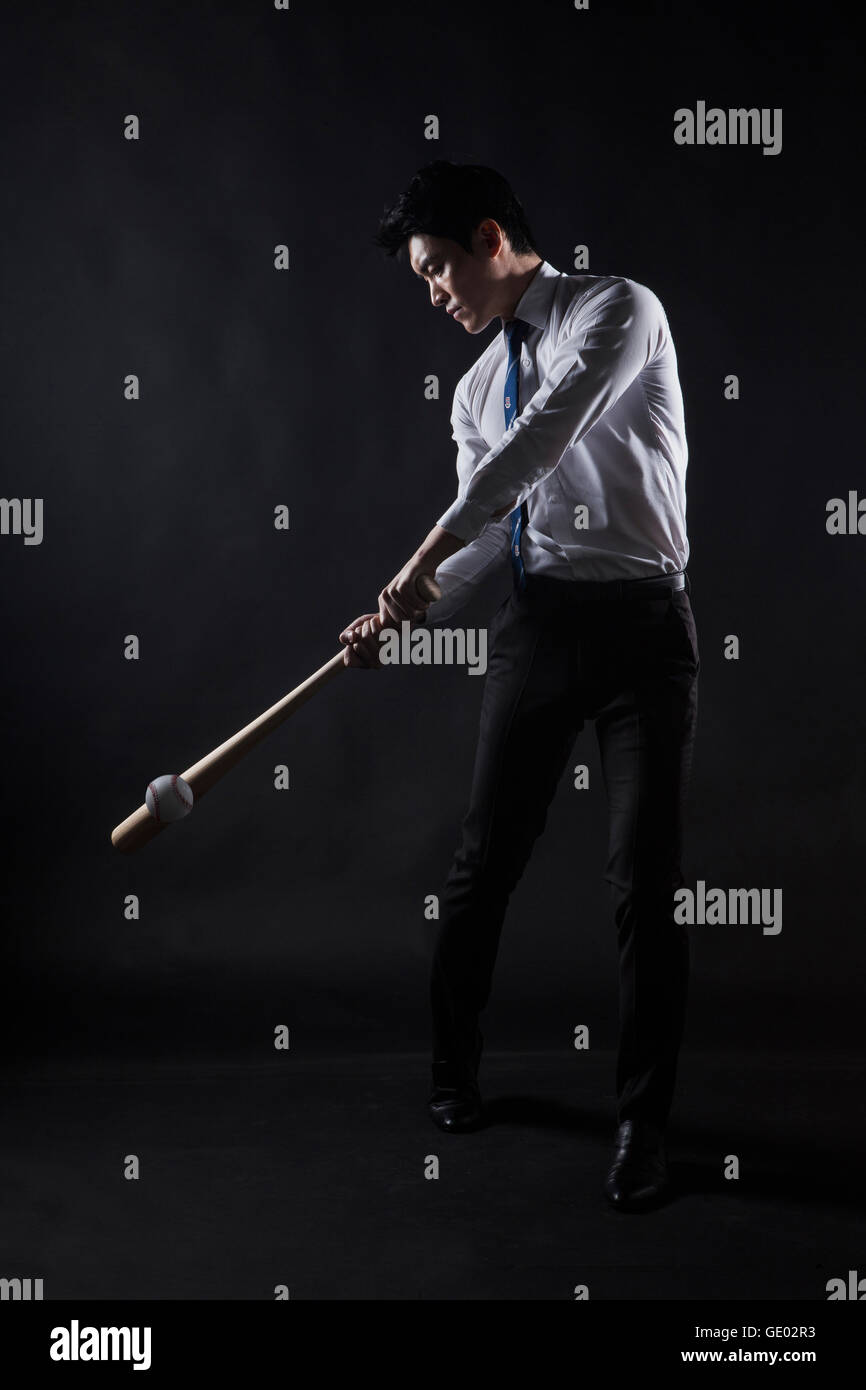 Business man hitting baseball bat hi-res stock photography and images ...