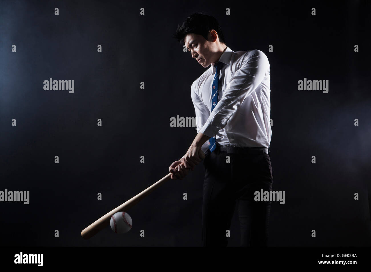 Business man hitting baseball bat hi-res stock photography and images ...
