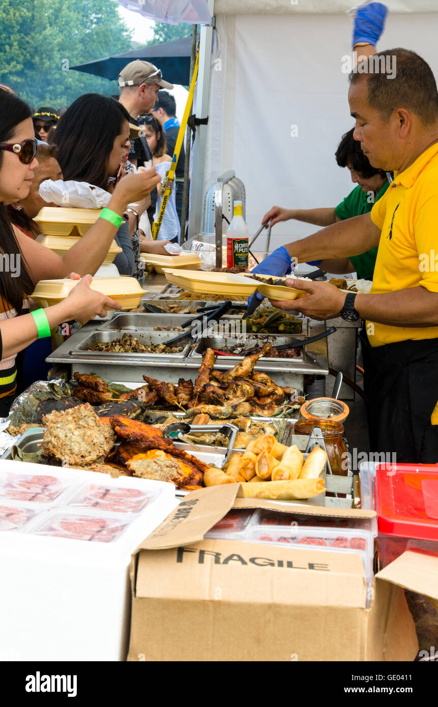 A stall selling traditional Filipino street food at the Barrio Fiesta ...