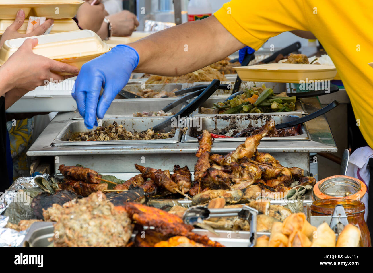 A stall selling traditional Filipino street food at the Barrio Fiesta ...