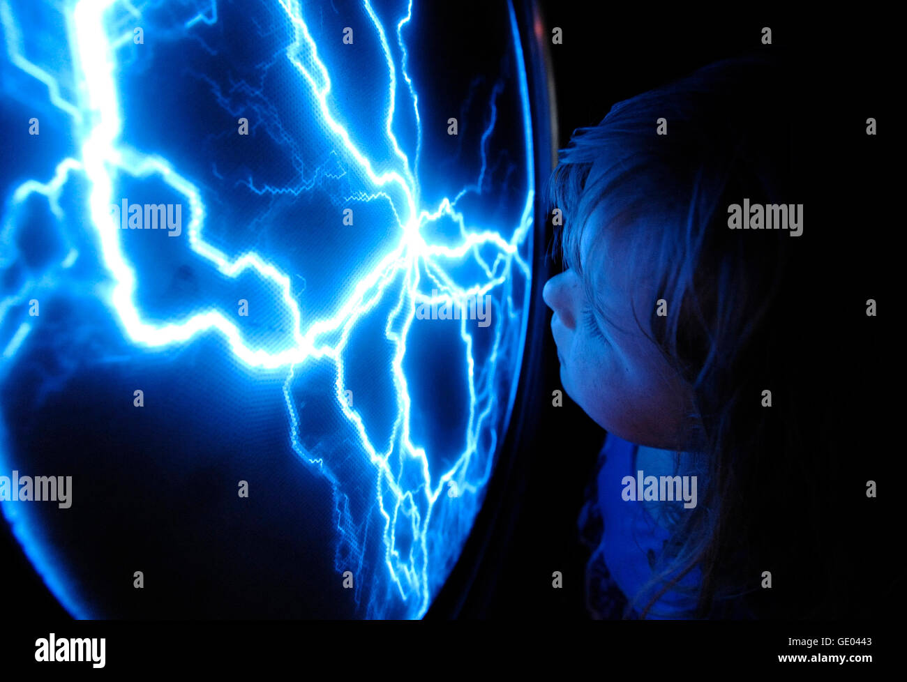 Child looking into a lightning screen at Herstmonceux science center ...