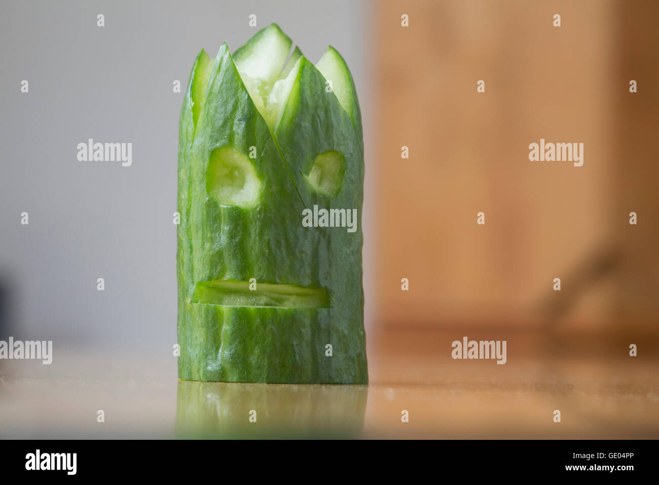 Close-up of smiley face cucumber on table Stock Photo - Alamy